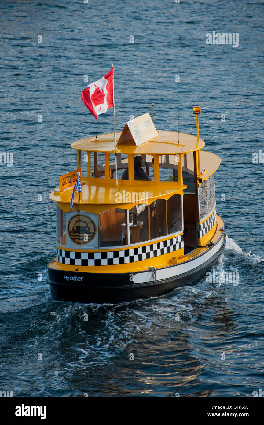 Water taxis run around the Inner Harbor of Victoria, British Columbia ...
