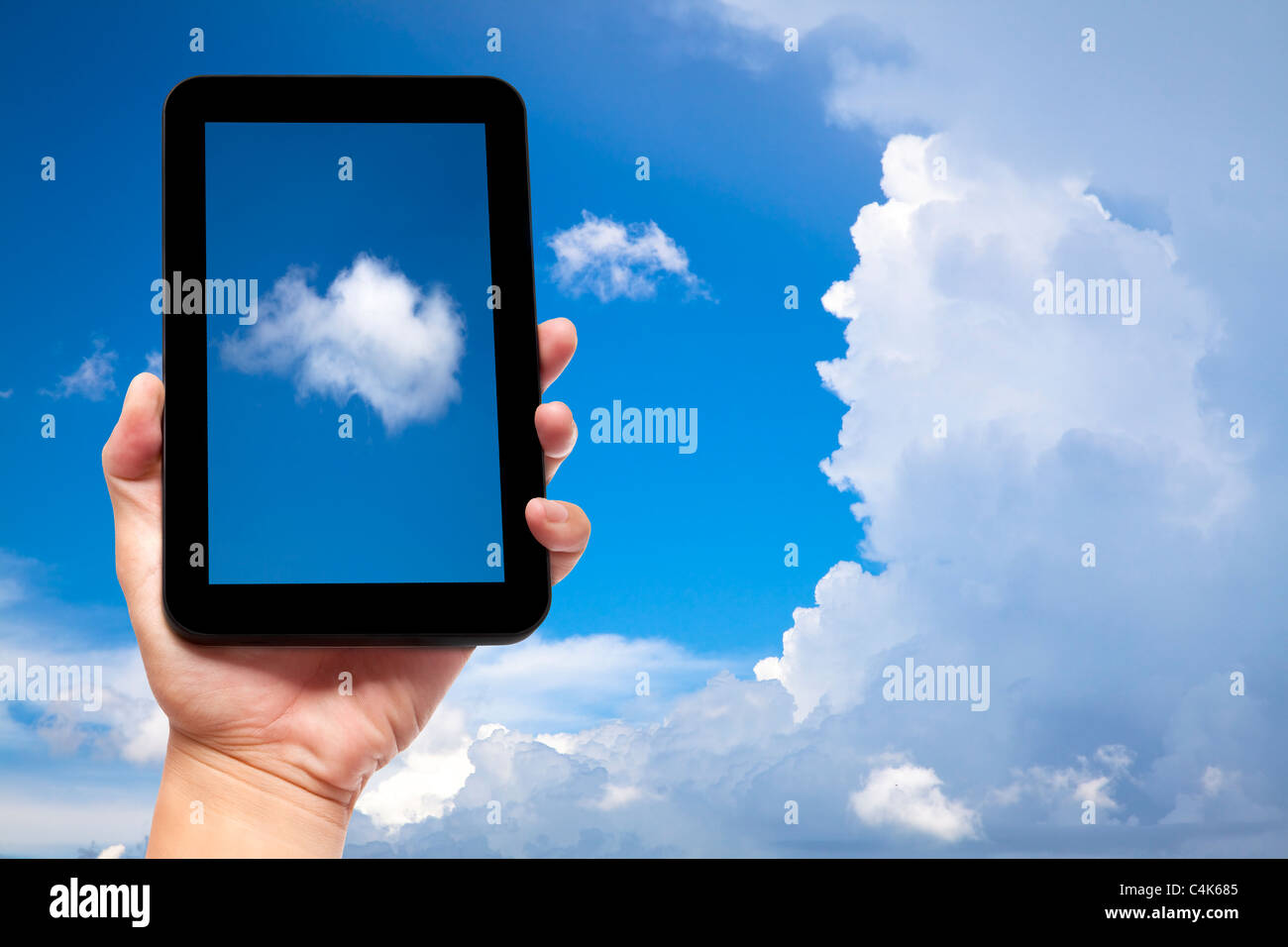 hand holding tablet pc with cloud background Stock Photo - Alamy