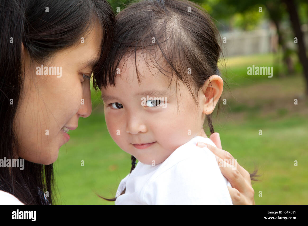 embarrassed little girl and her mother Stock Photo - Alamy