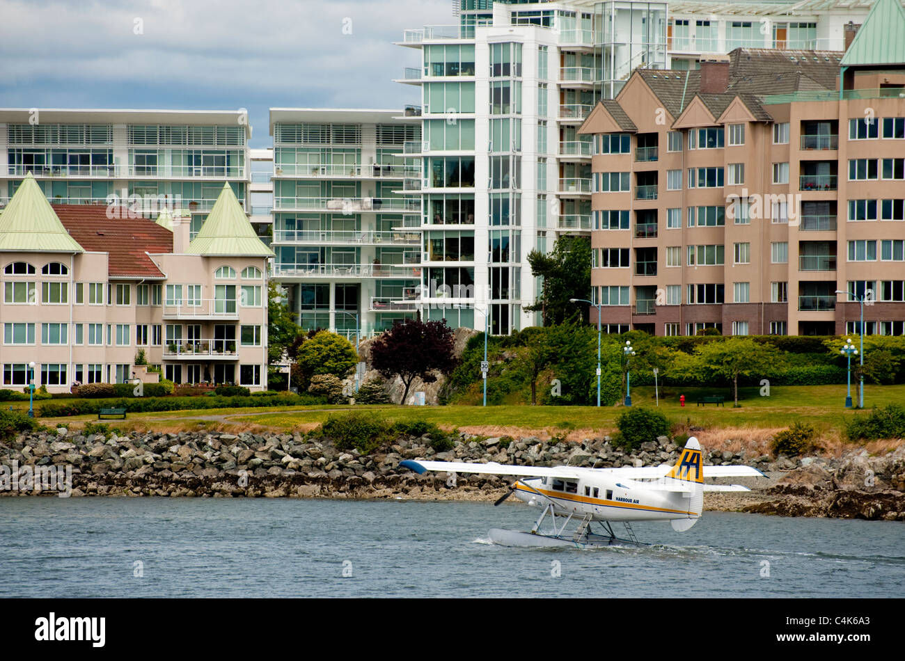 A seaplane prepare to take off past hotels and condominiums in the ...
