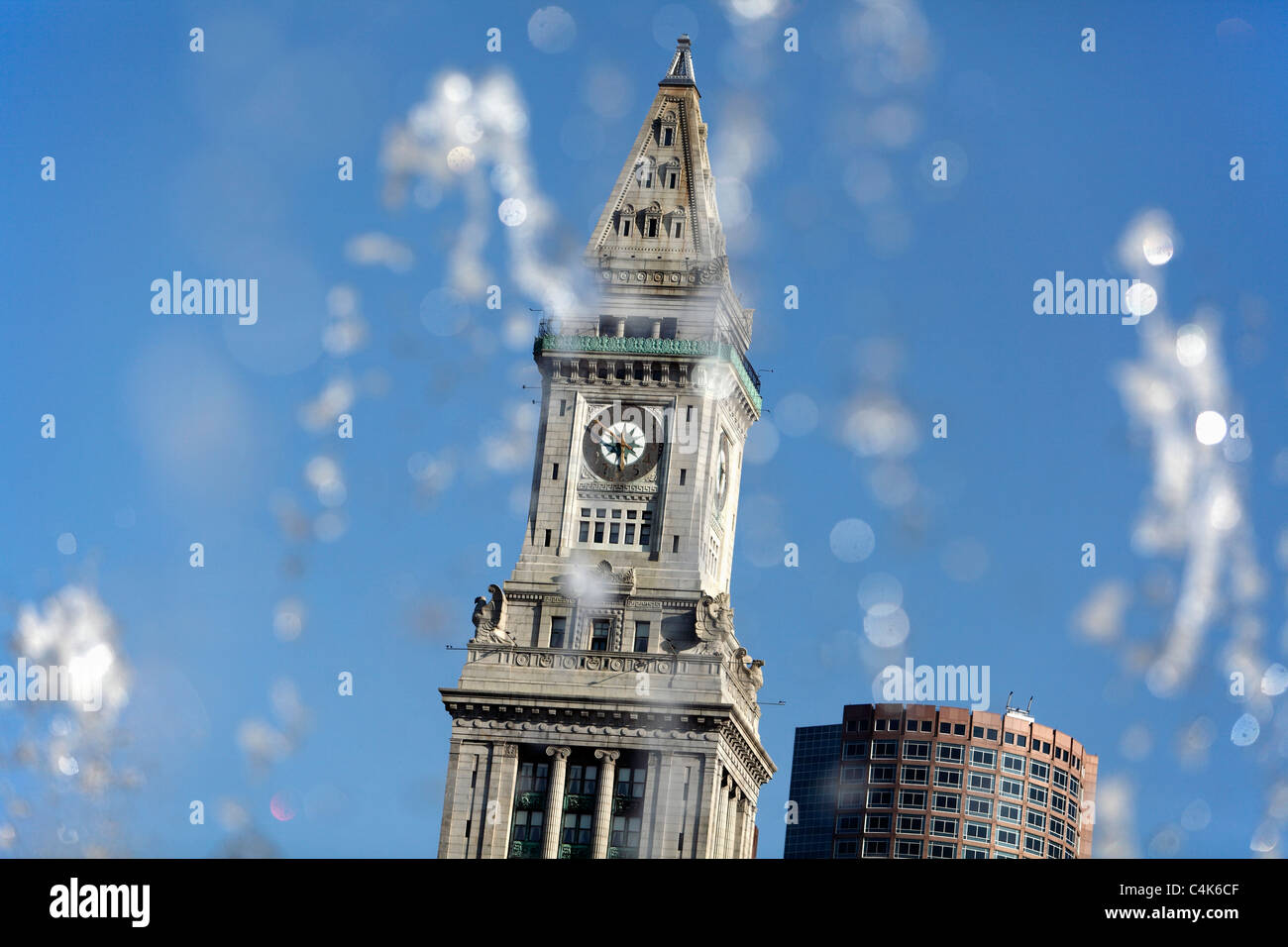 The Custom House tower is seen through a fountain on the Greenway in ...