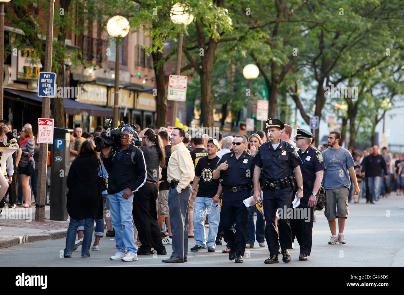 Media, police and fans gather near Boston Garden in Boston as the ...
