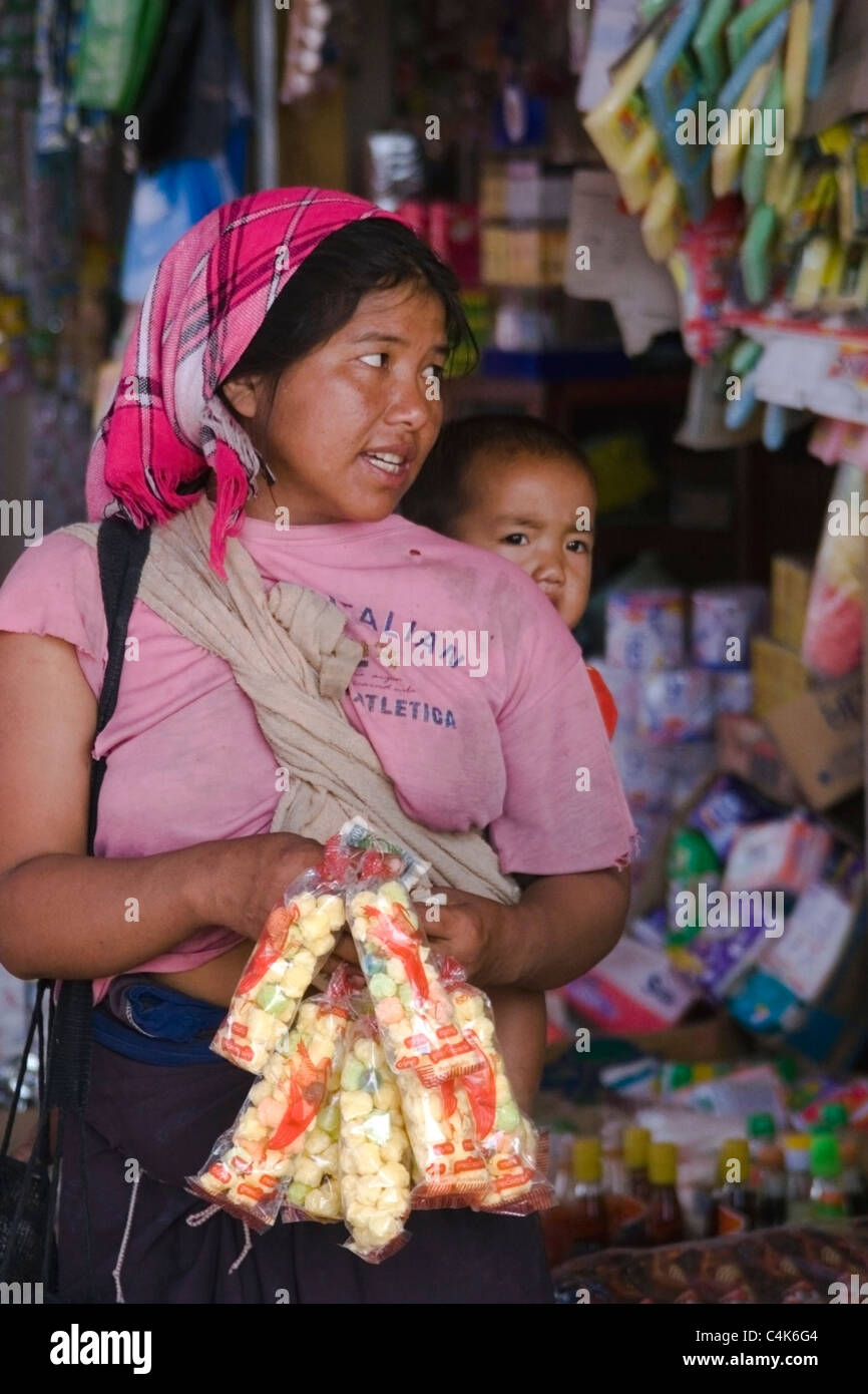 An ethnic hill tribe woman living in poverty is shopping at a food ...