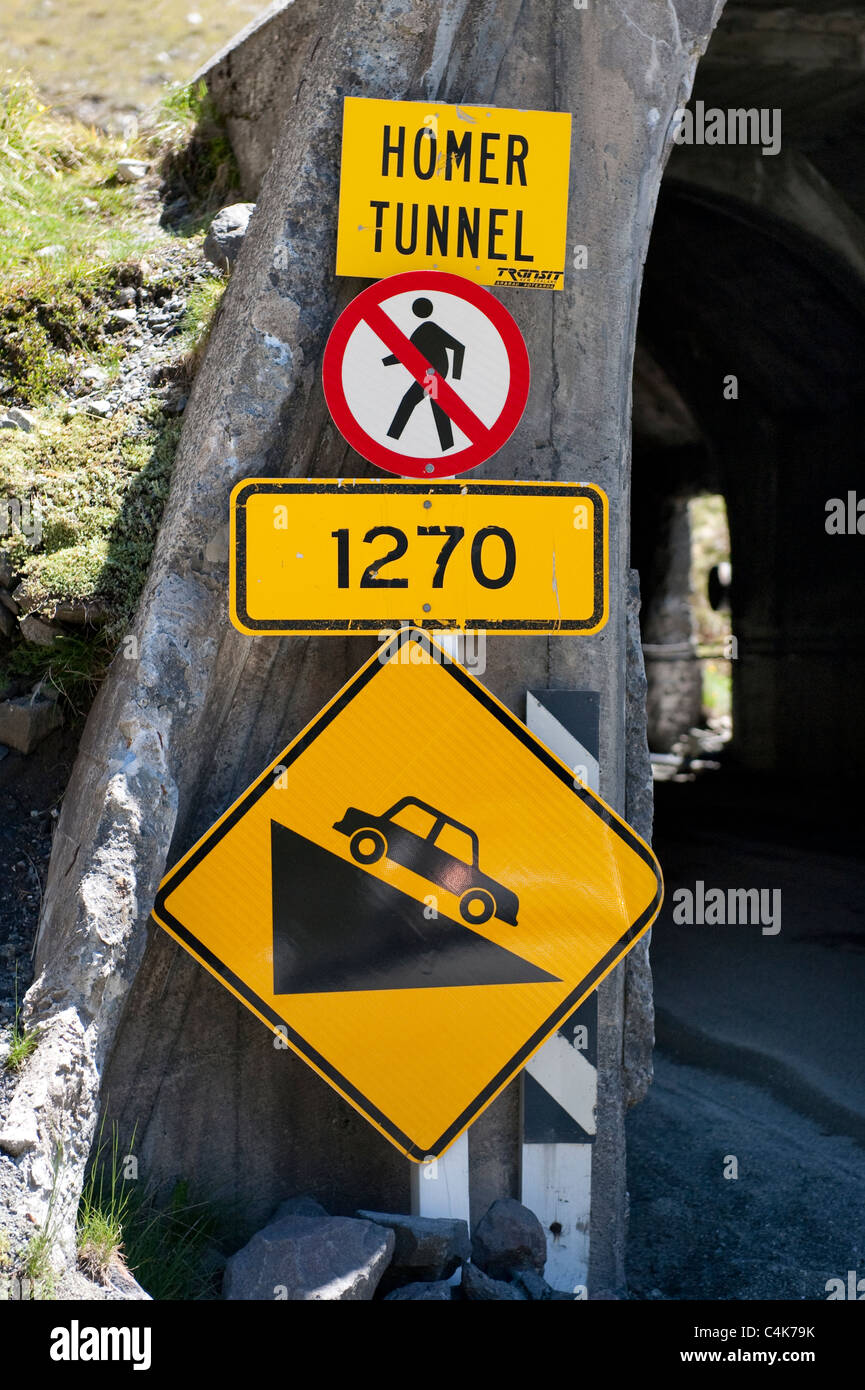 Warning signs at the entrance to the Homer Tunnel on Highway 94 ...