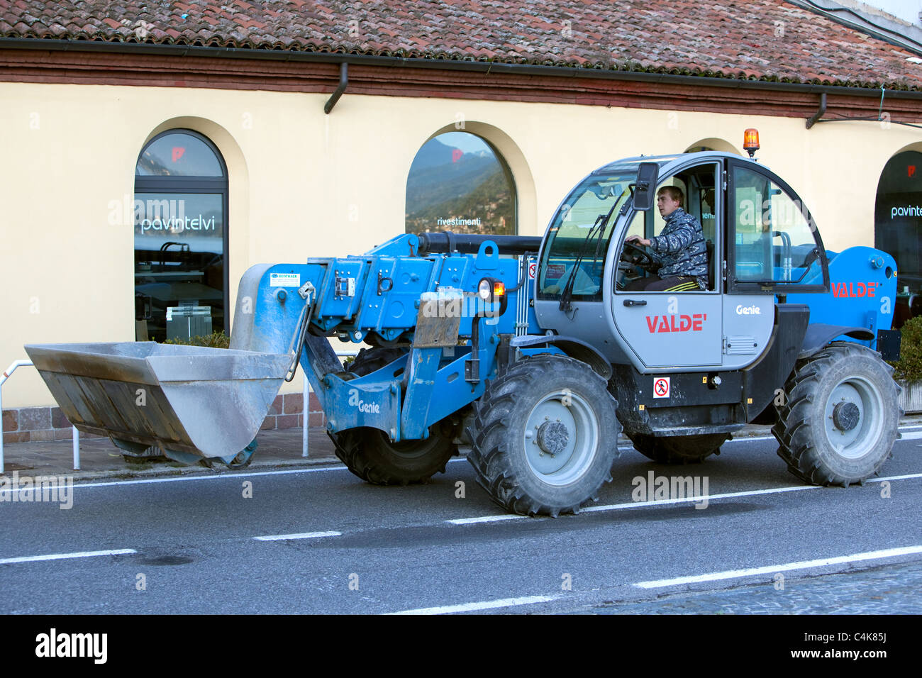 Construction vehicle passing through Argegno Italy Stock Photo - Alamy