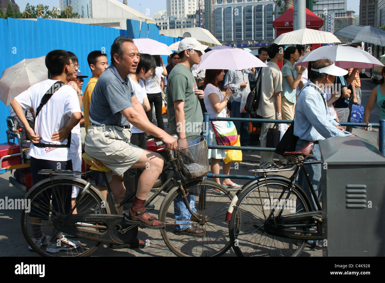 Shanghai China streetscene bike bikes cycling busy Stock Photo - Alamy