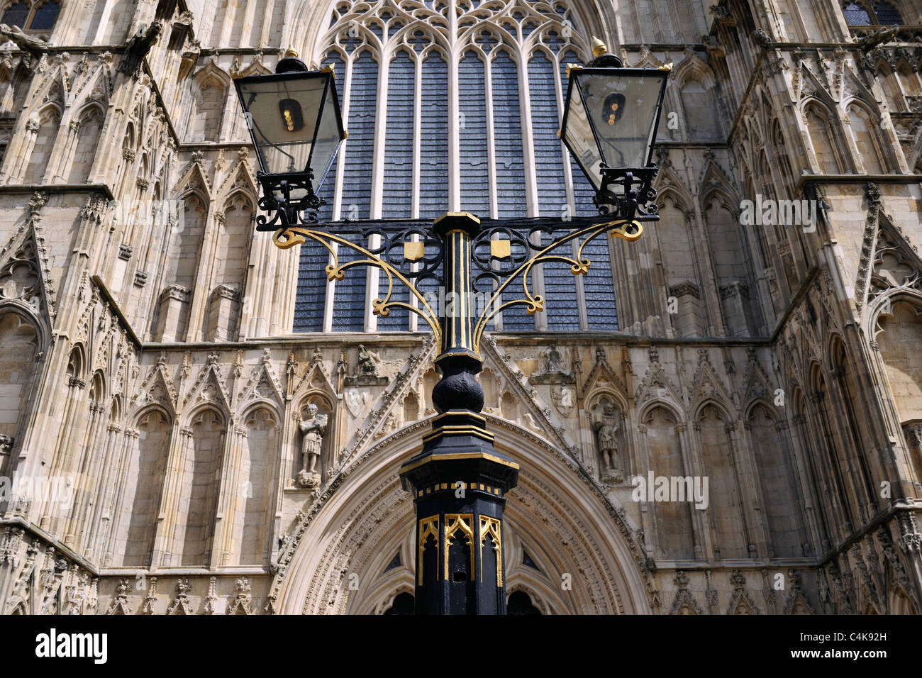 Victorian street lamps below the West window of York Minster, Yorkshire ...