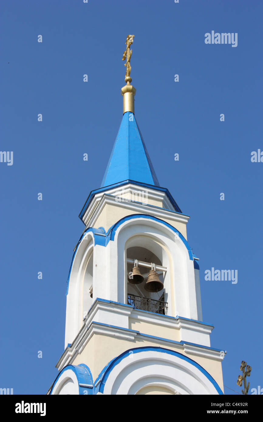 Christian church with dark blue domes of white color against the dark ...