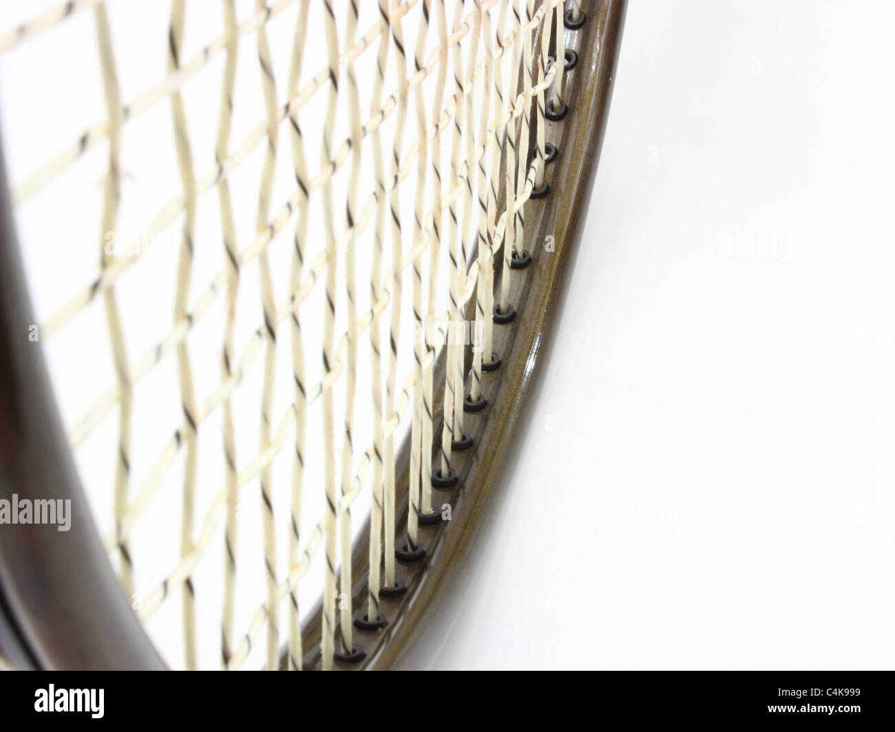 Tennis racket of brown color on a white background Stock Photo - Alamy