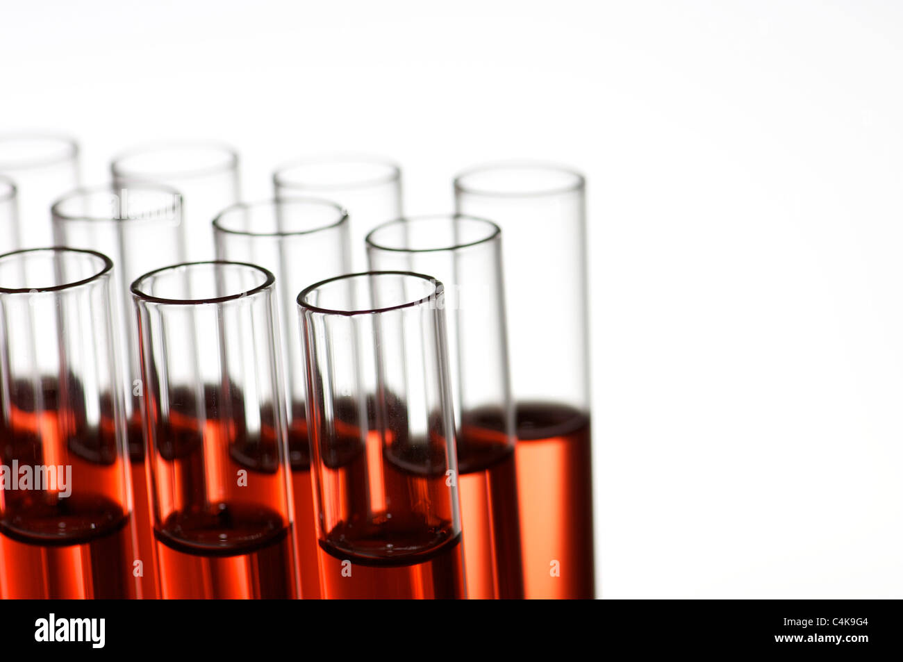 group of laboratory test tubes with red liquid inside Stock Photo - Alamy