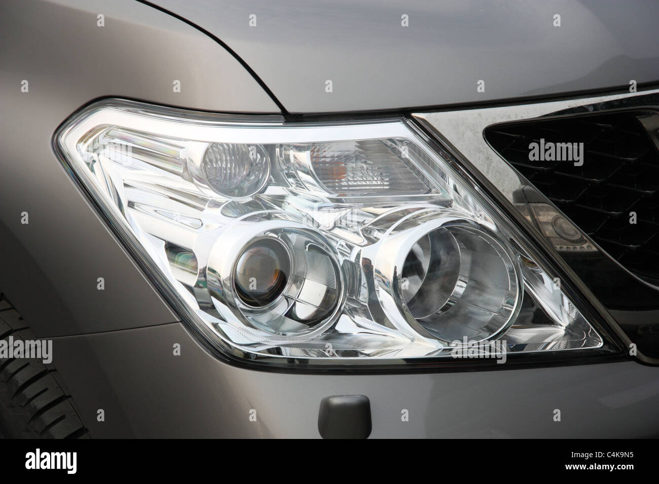Closeup of car headlight - front view Stock Photo - Alamy