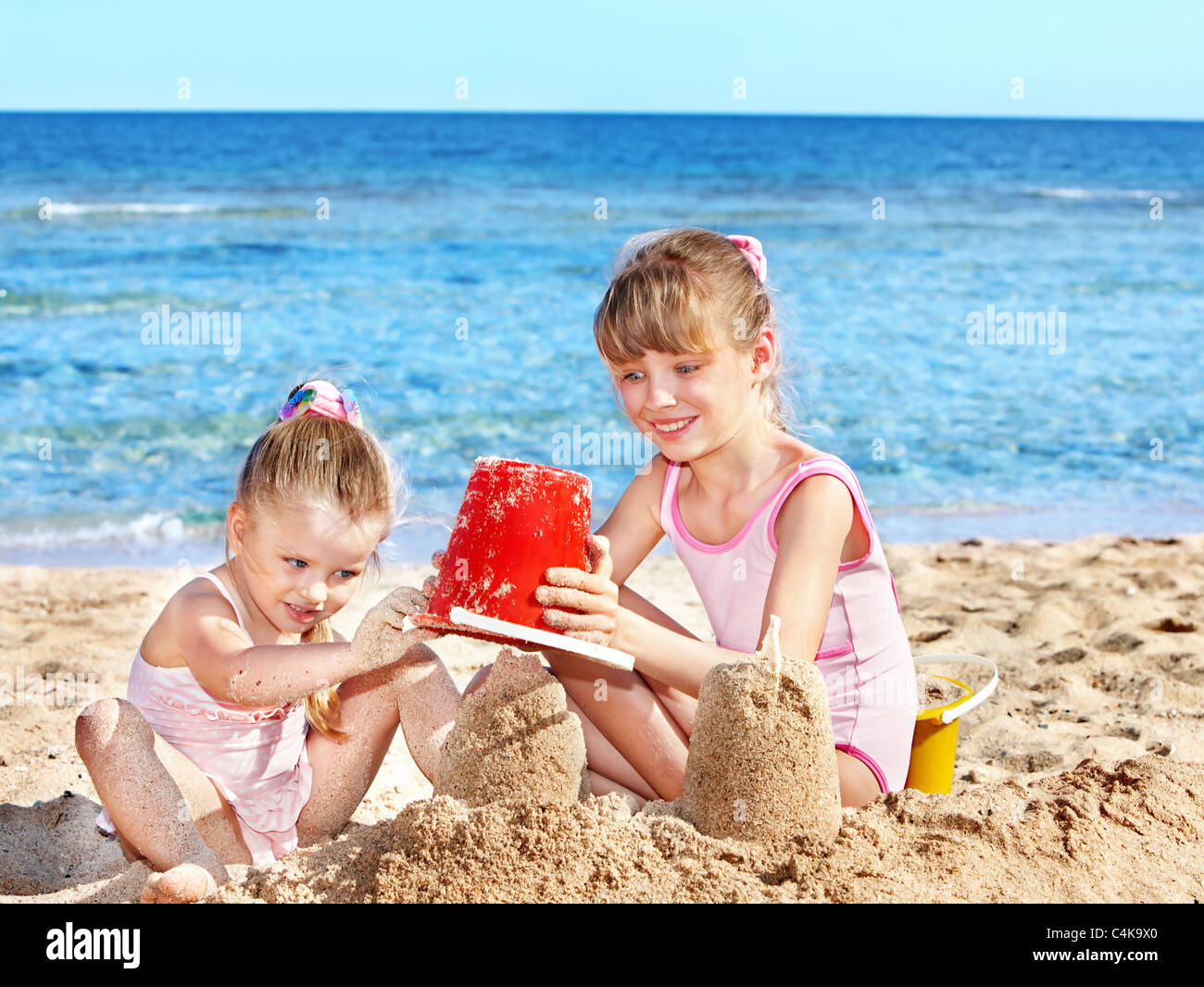 Children playing on beach near sea Stock Photo - Alamy