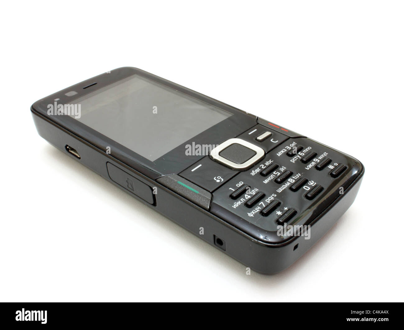 Black mobile stylish classical phone with buttons on a white background ...