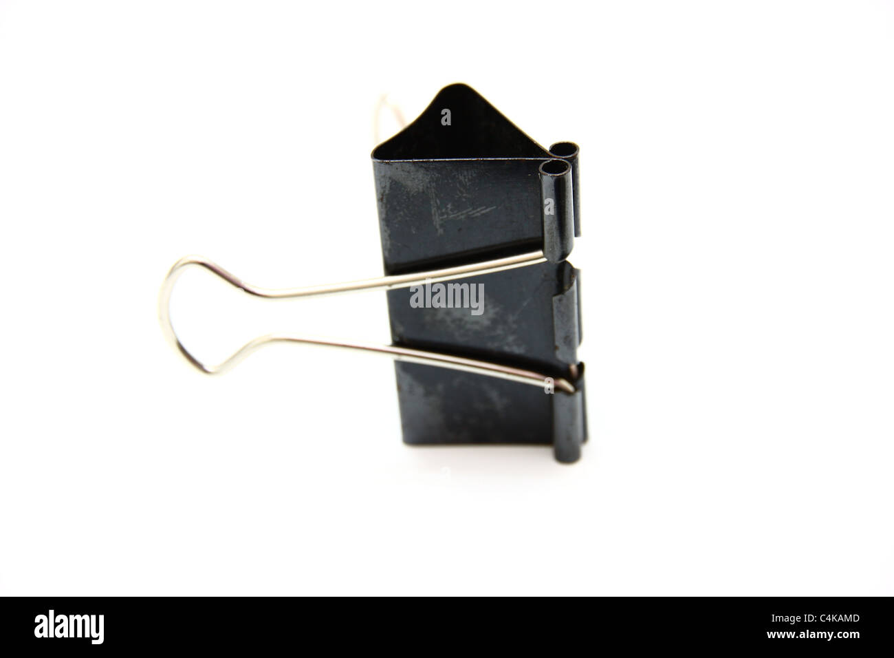 The big black metal clip on a white background Stock Photo - Alamy