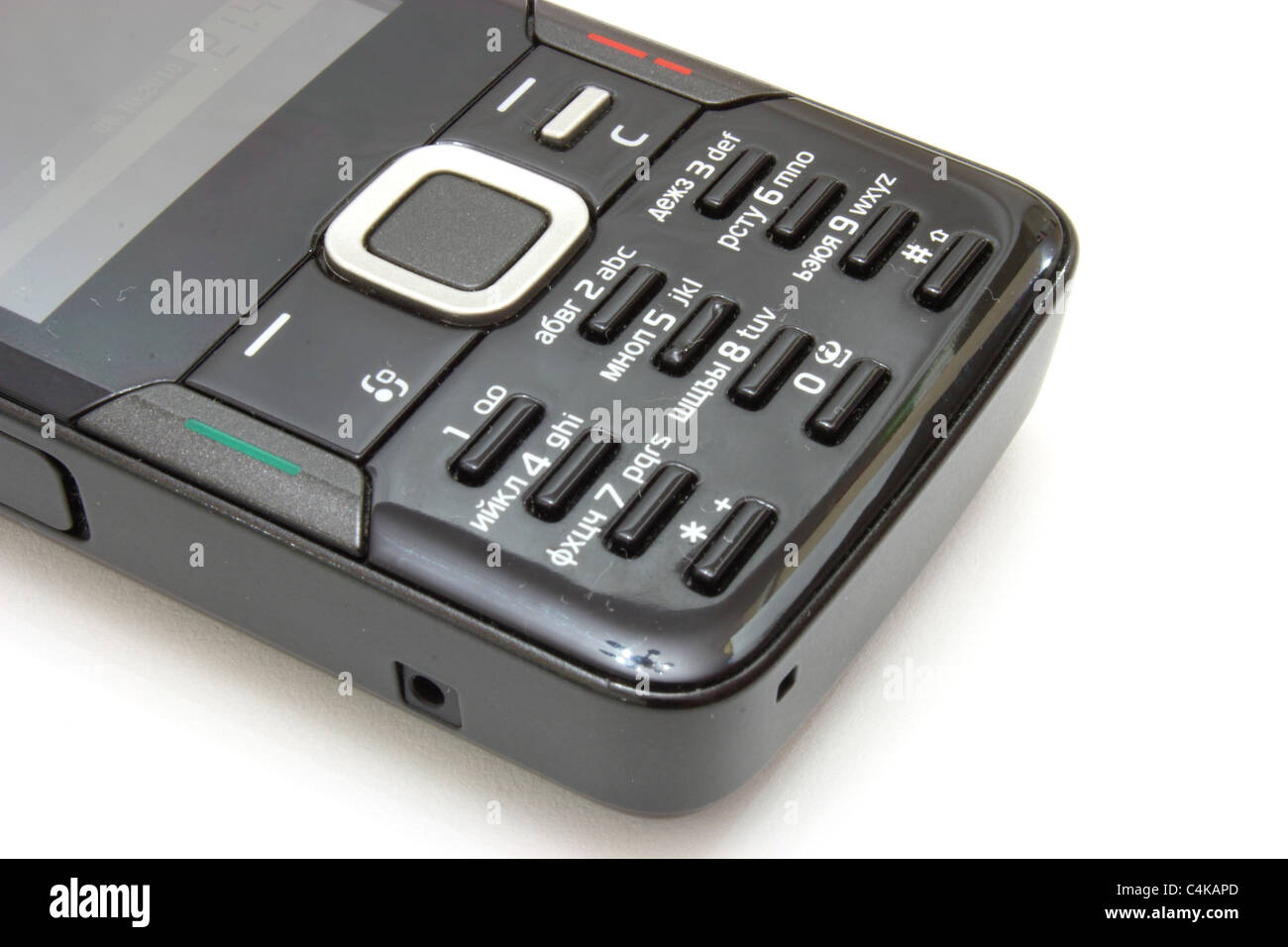 Black mobile stylish classical phone with buttons on a white background ...