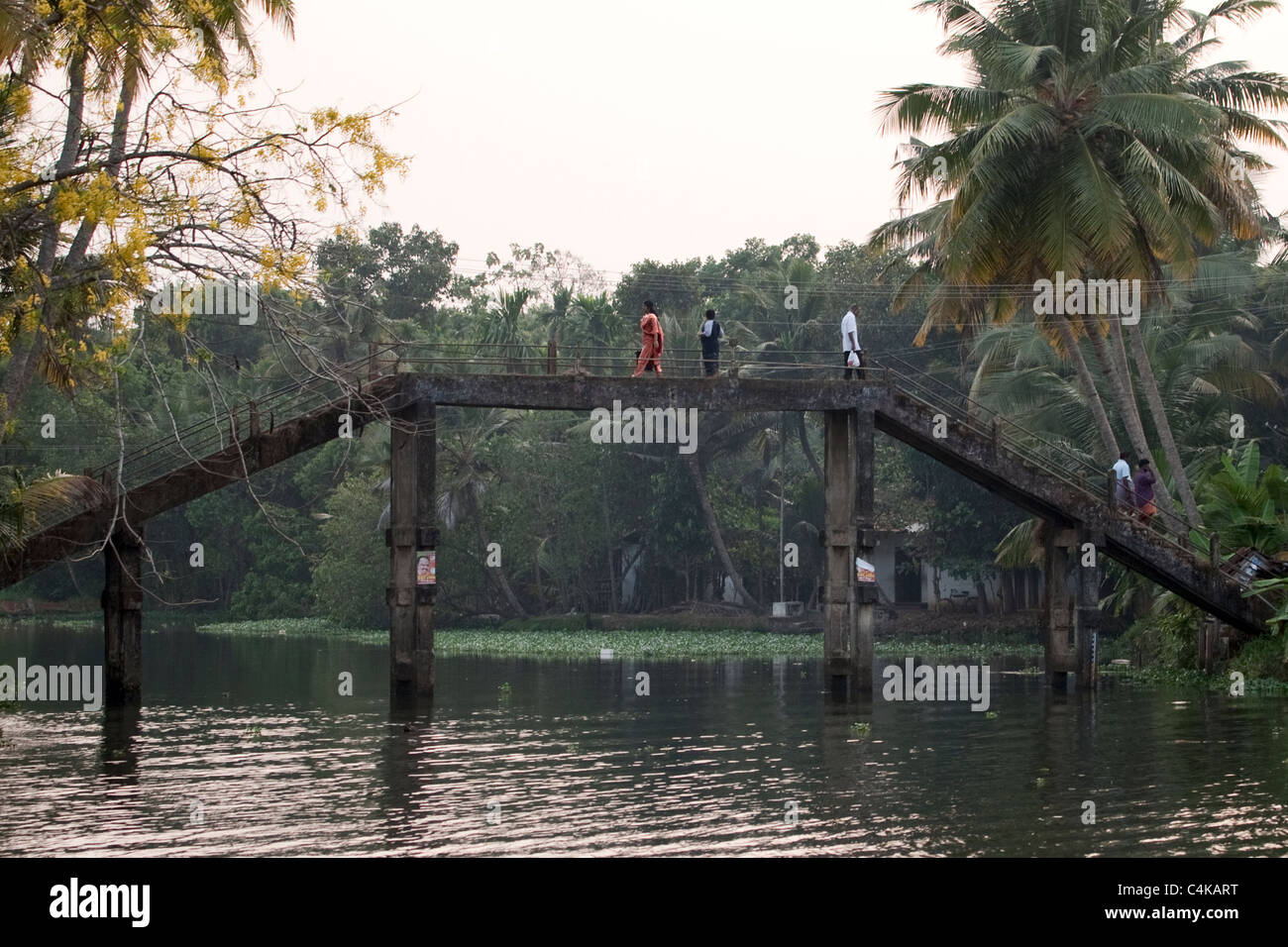 People crossing a canal in the backwaters of Alleppey (Alappuzha ...