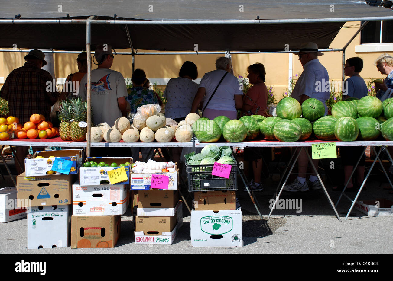 Customers line up to make purchases at the Saturday morning Farmers ...