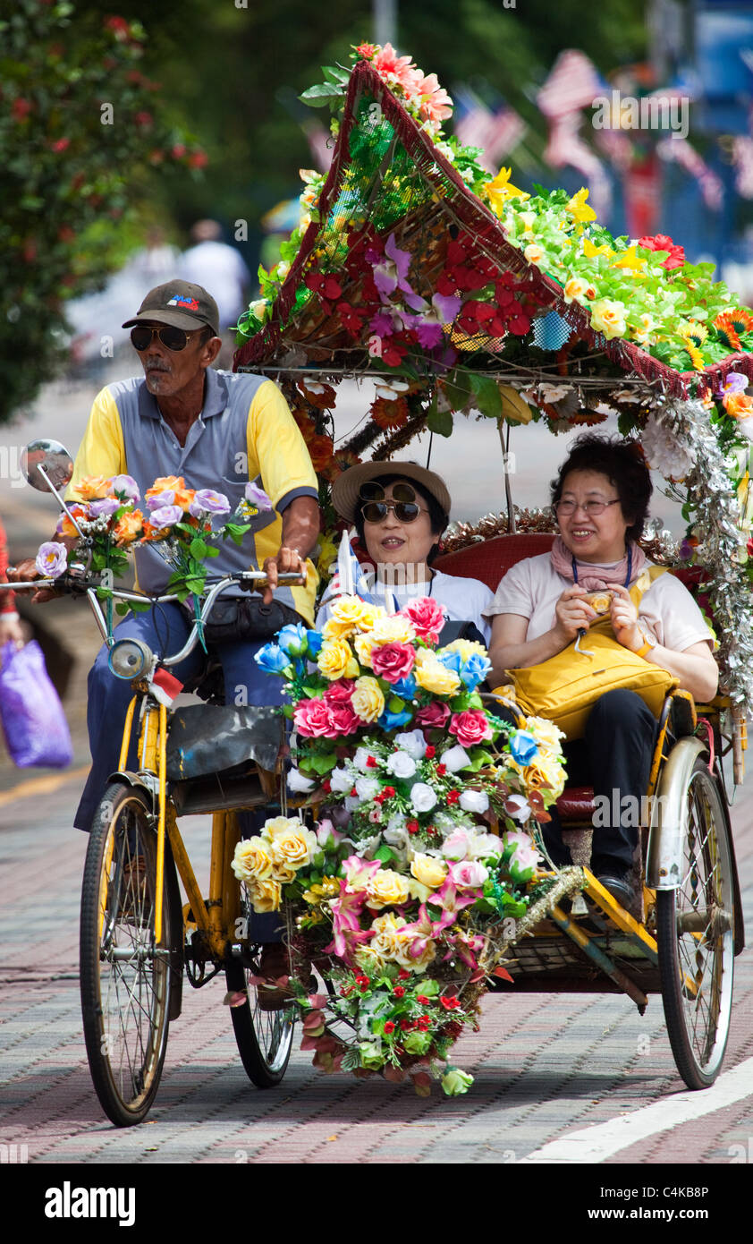 A Rickshaw Ride in Melaka, Malaysia Stock Photo - Alamy