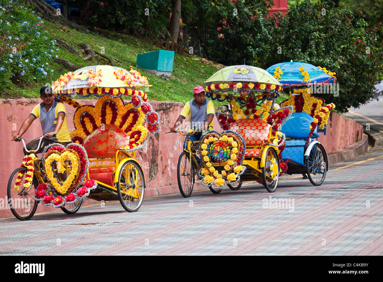Three Colourful Rickshaw in Melaka, Malaysia Stock Photo - Alamy