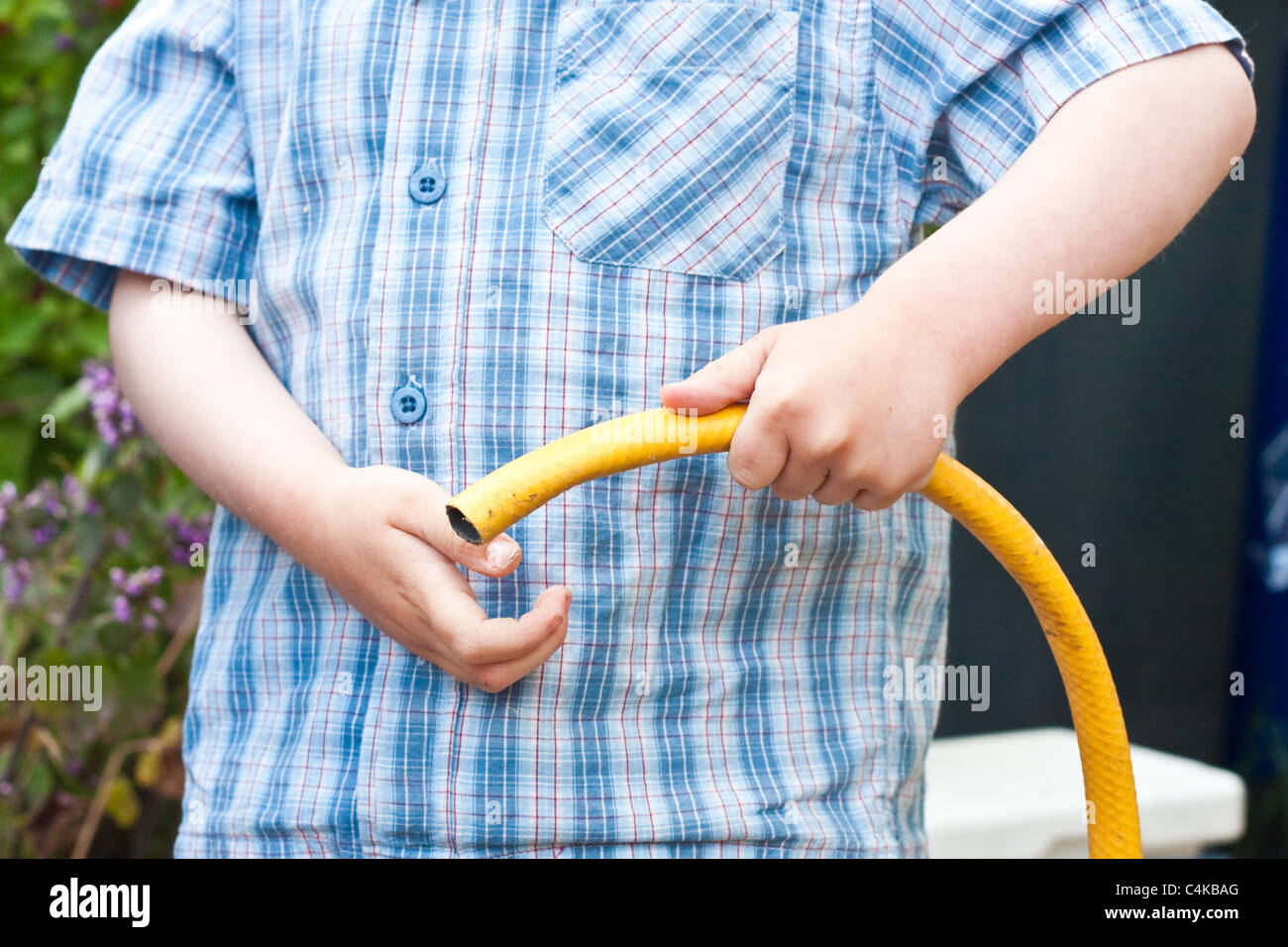 Boy hose pipe hi-res stock photography and images - Alamy