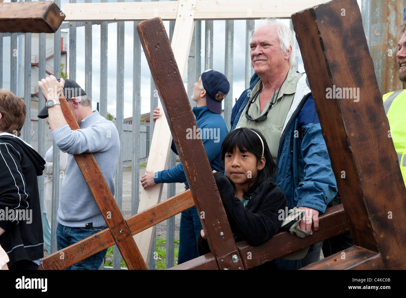 Marchers led by Arthur Blessitt carrying large wooden crosses ...