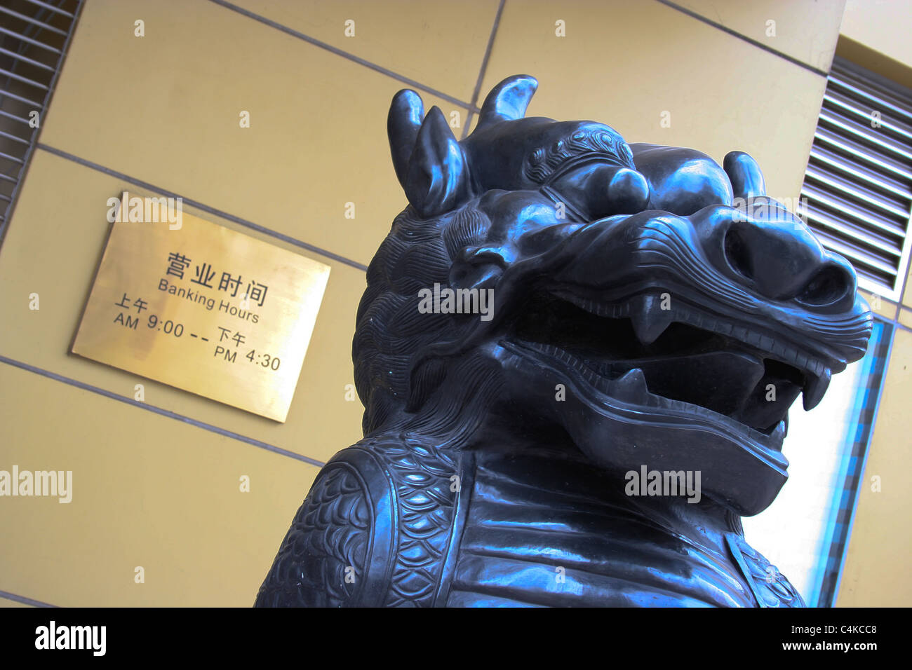 Lion Effigy Banking opening hours statue Stock Photo - Alamy