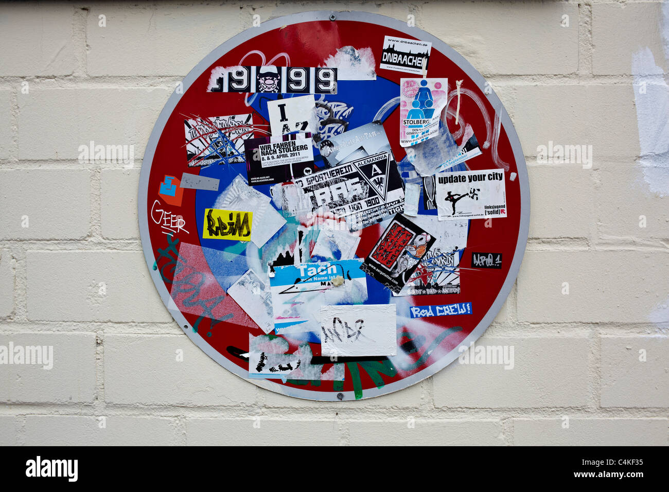 Traffic/street sign covered with graffiti stickers in Aachen, Germany ...