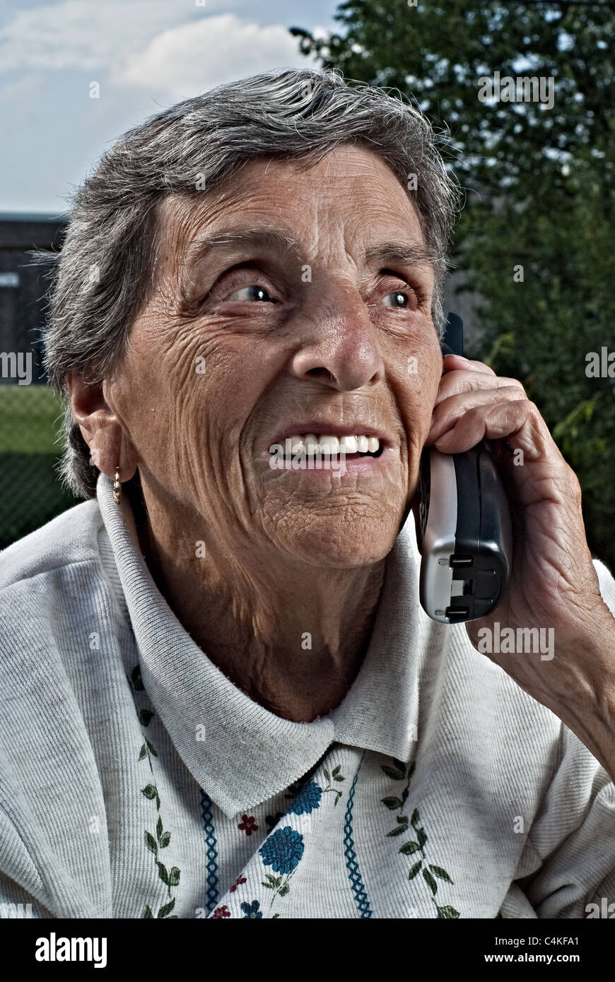 Elderly lady using cordless phone hi-res stock photography and images ...
