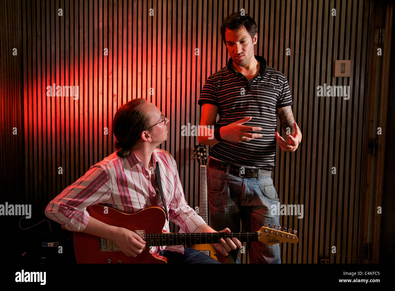 Session guitarist discussing the music in a studio in Sheffield ...