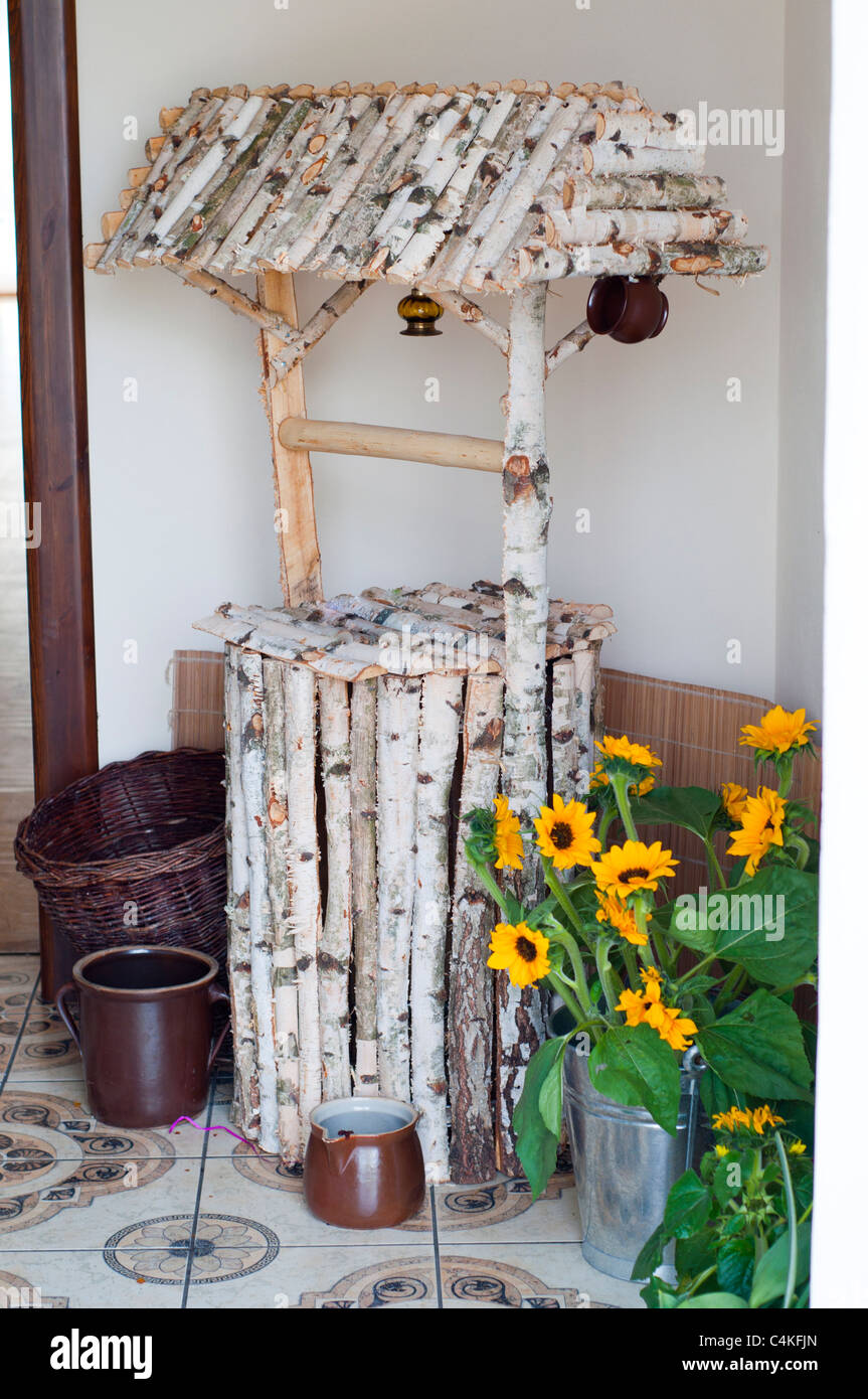 decorative well constructed from pieces of birch Stock Photo - Alamy
