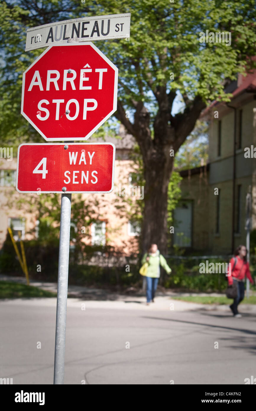A French-English bilingual stop sign is seen on rue Aulneau street in ...
