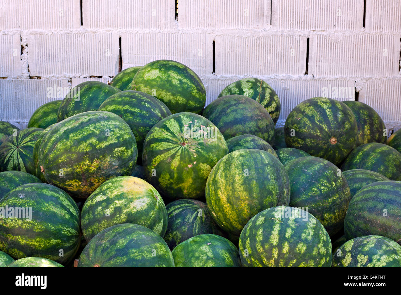 Watermelons stacked on pavement in Turkish street market Stock Photo ...