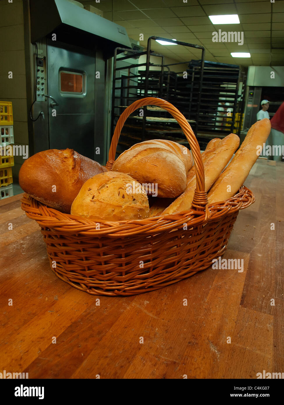 Bread in a basket, inside of a bakery Stock Photo - Alamy