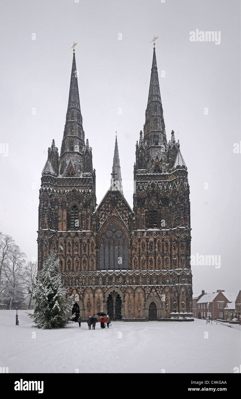 Lichfield Cathedral showing the west front and three spires during a ...