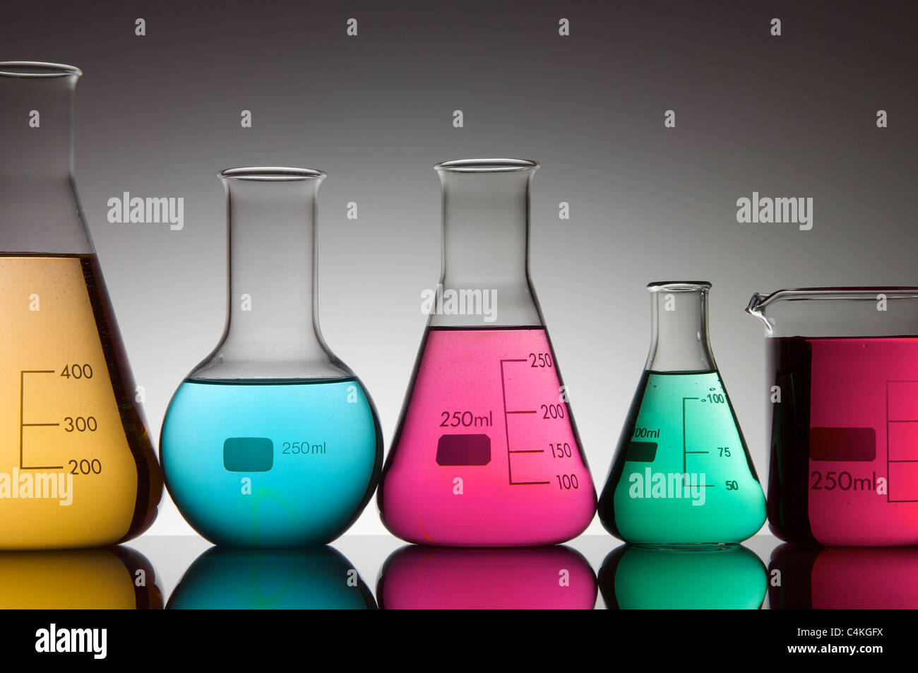 five flasks with bright colored liquid Stock Photo - Alamy