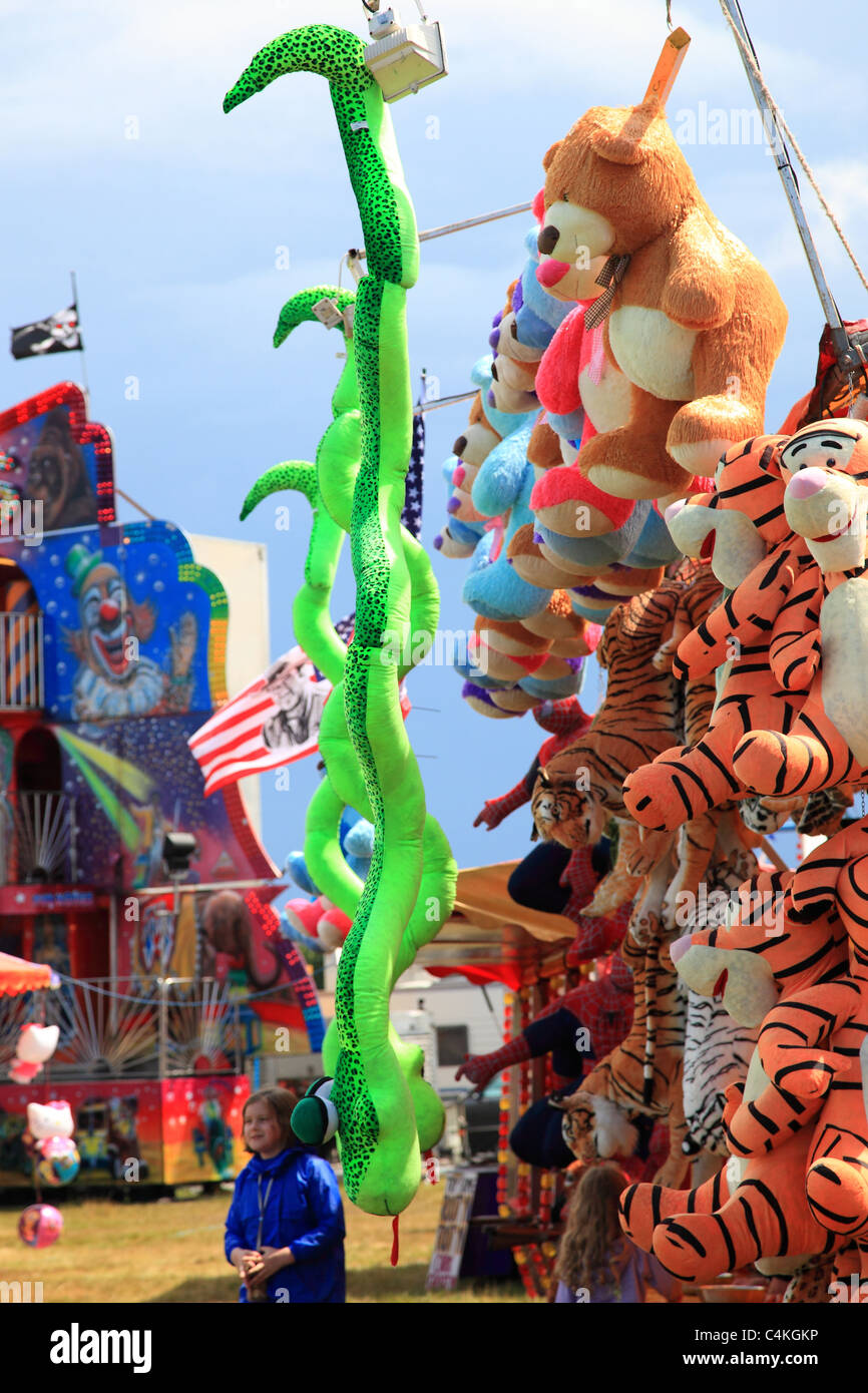 Girls by cuddly toys stand at Wimbledon village Fair on Wimbledon Green ...