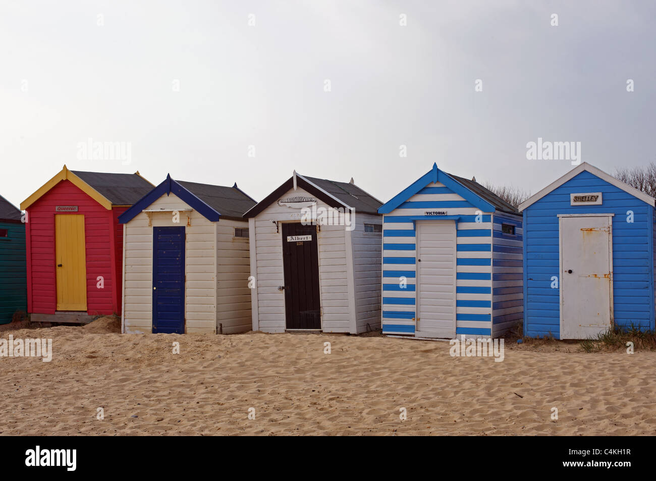 Brightly painted beach huts southwold hi-res stock photography and ...