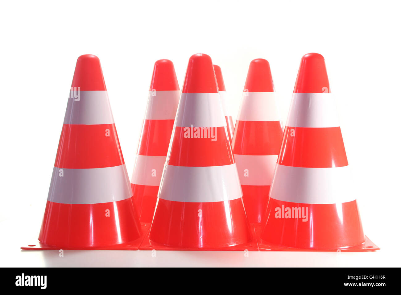 red and white construction pylons before a white background Stock Photo ...