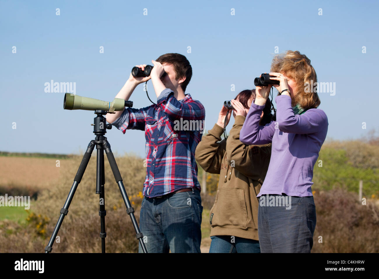 Bird watching; three people; Godolphin; Cornwall Stock Photo - Alamy