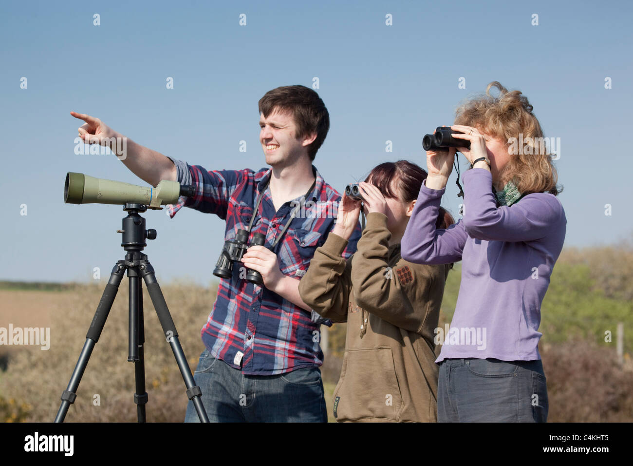 Bird watching; three people; Godolphin; Cornwall Stock Photo - Alamy