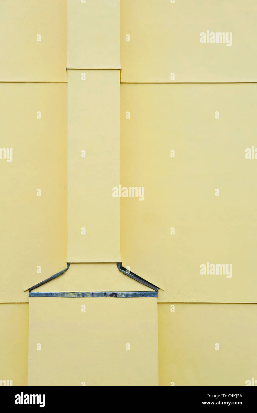 A chimney stack on an outside wall of a house. The horizontal lines are ...