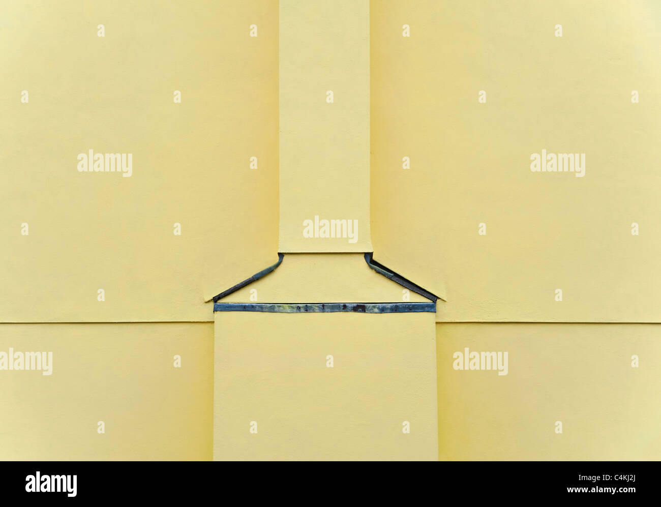 A chimney stack on an outside wall of a house. The horizontal lines are ...