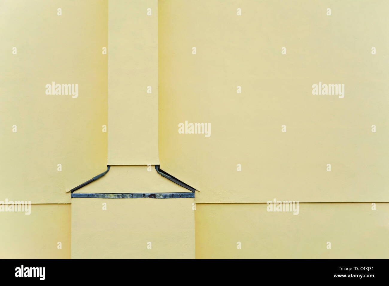 A chimney stack on an outside wall of a house. The horizontal lines are ...