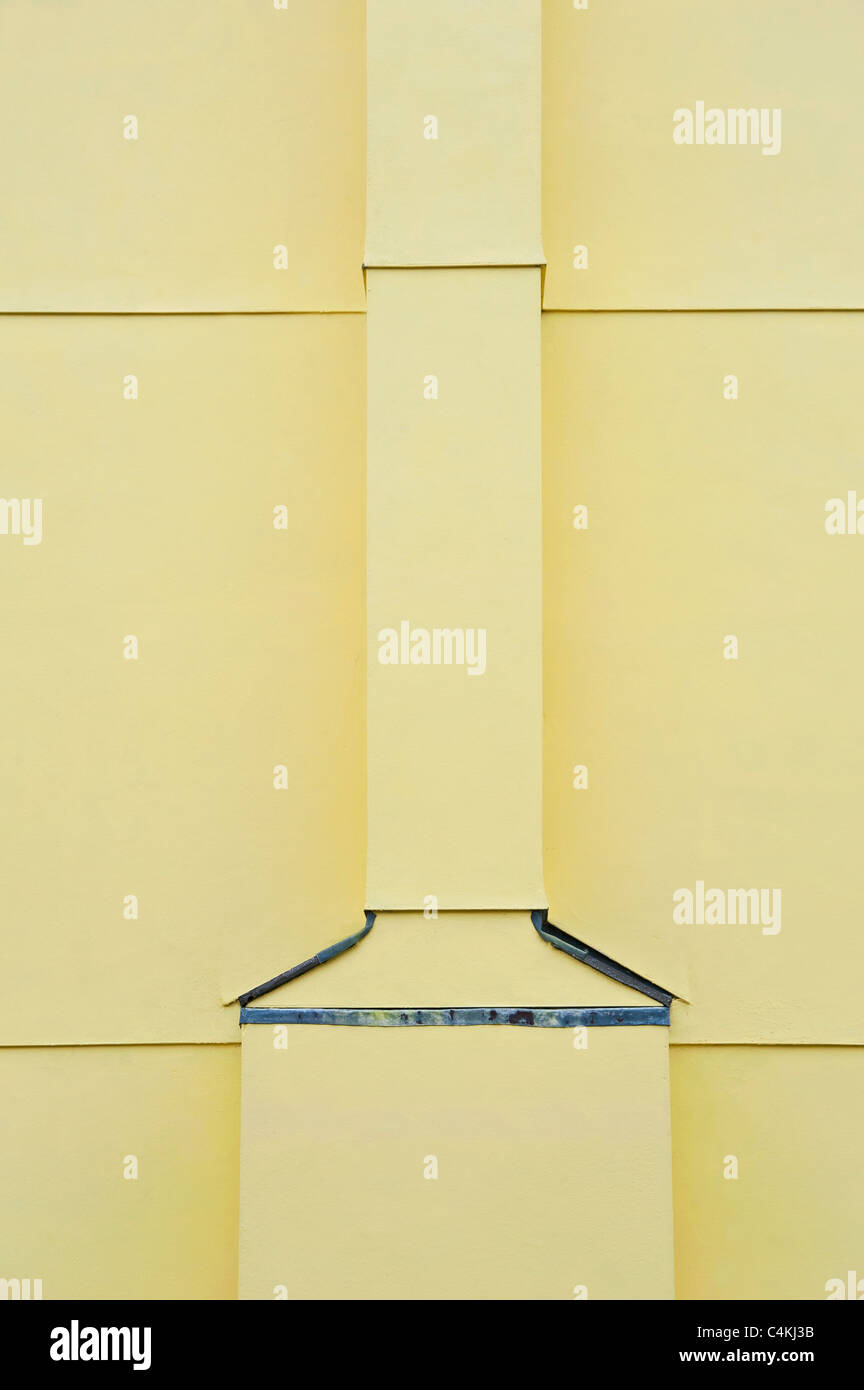 A chimney stack on an outside wall of a house. The horizontal lines are ...