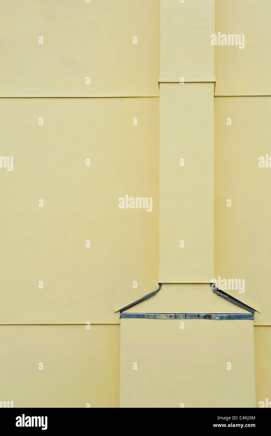 A chimney stack on an outside wall of a house. The horizontal lines are ...