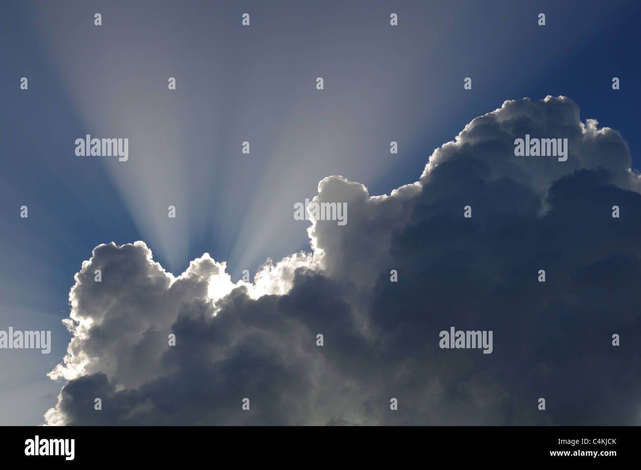 Sun shining through the clouds Stock Photo - Alamy