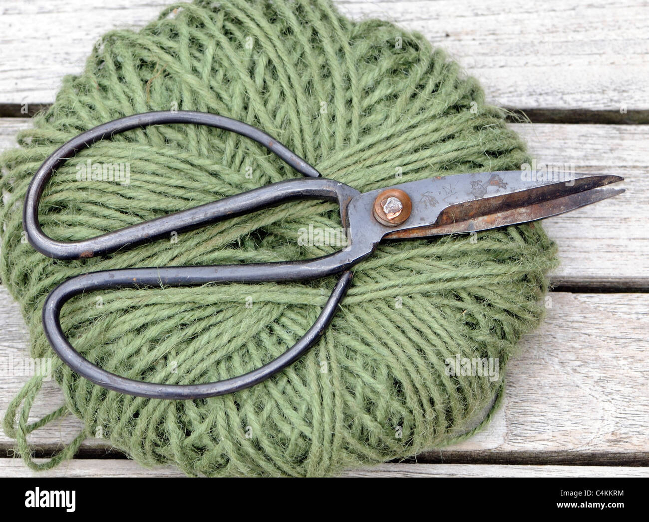 A roll of garden string with japanese scissors Stock Photo - Alamy