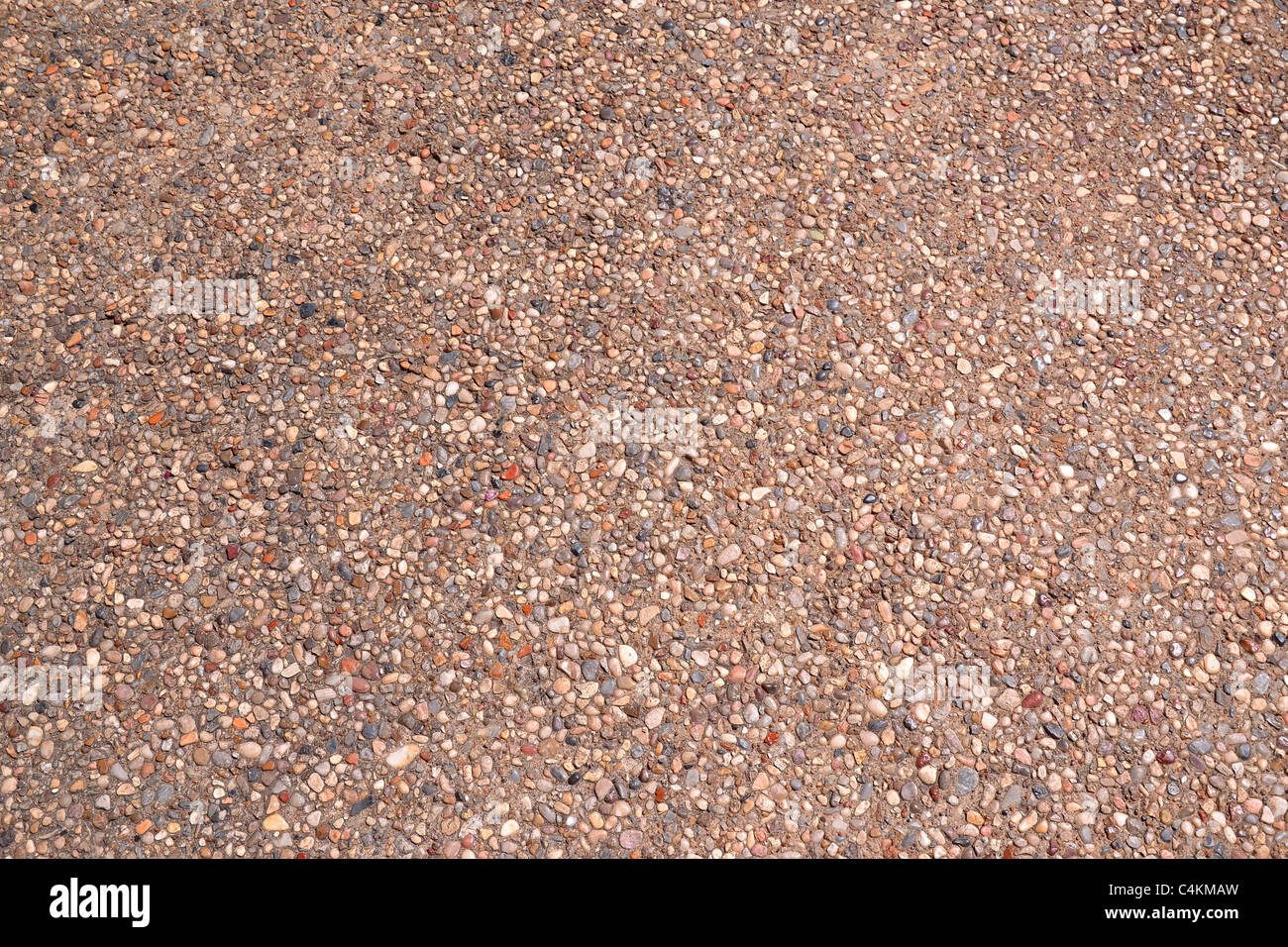 A close up view of pebbles and cement Stock Photo - Alamy