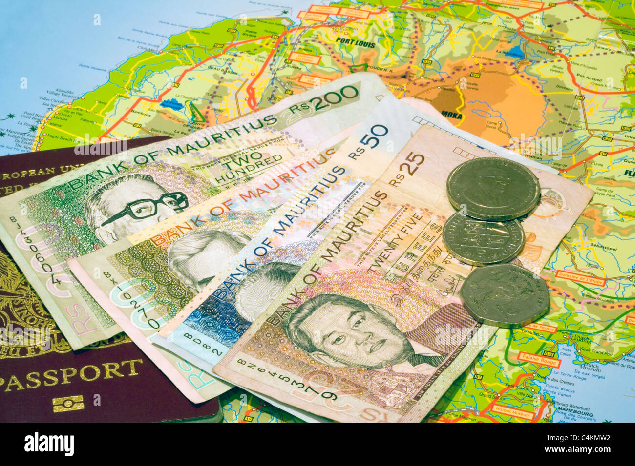 Mauritian Currency Bank notes and coins UK Passport on map of Mauritius ...