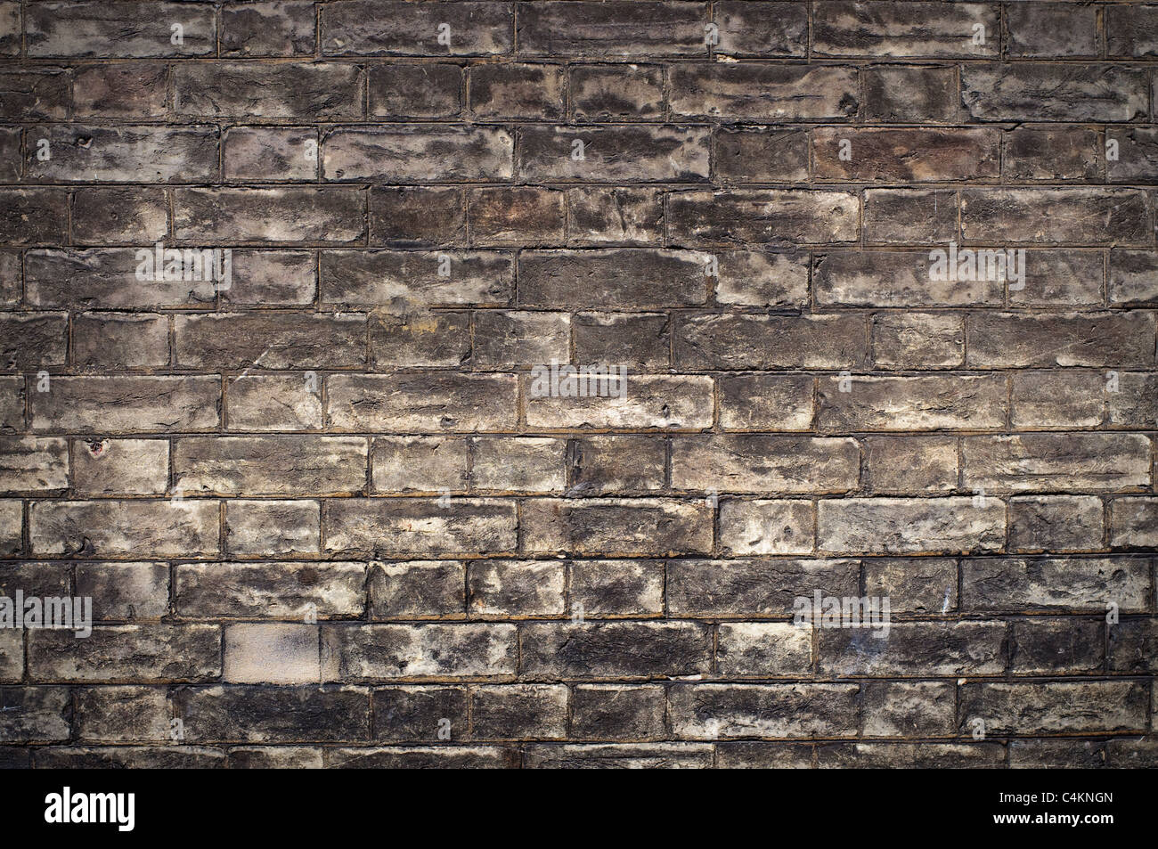 Old black brick wall vintage style Stock Photo - Alamy